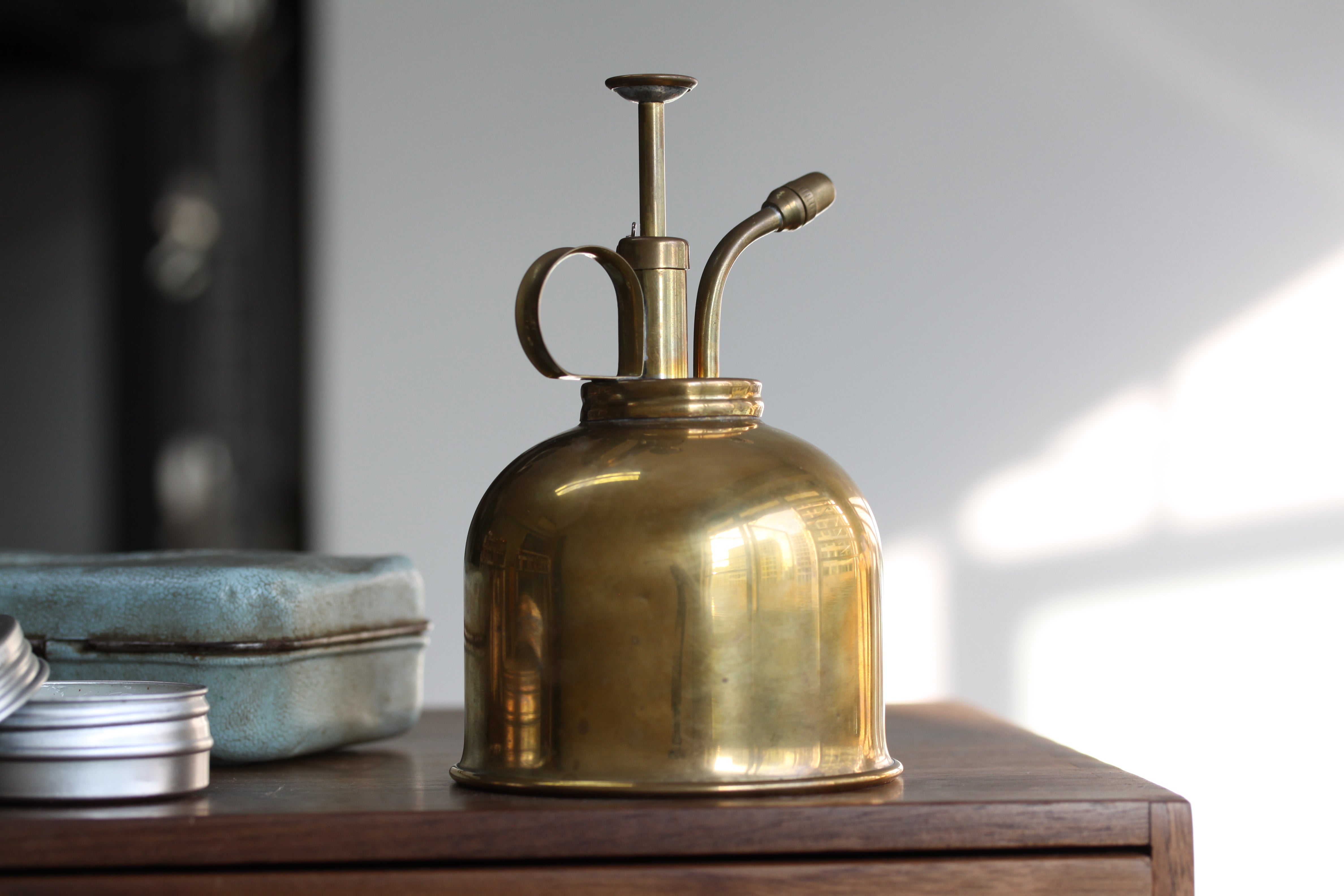 Brass spray bottle store